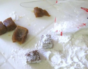 Once the mochi is cool, use a plastic knife to cut it into squares ...