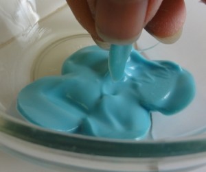 Take the solid ‘ears’ and dip the ends into the melted blue melts and ...